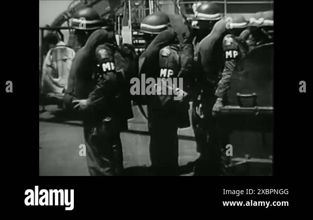 An amphibious support troop of soldiers get off a battleship and take a ...