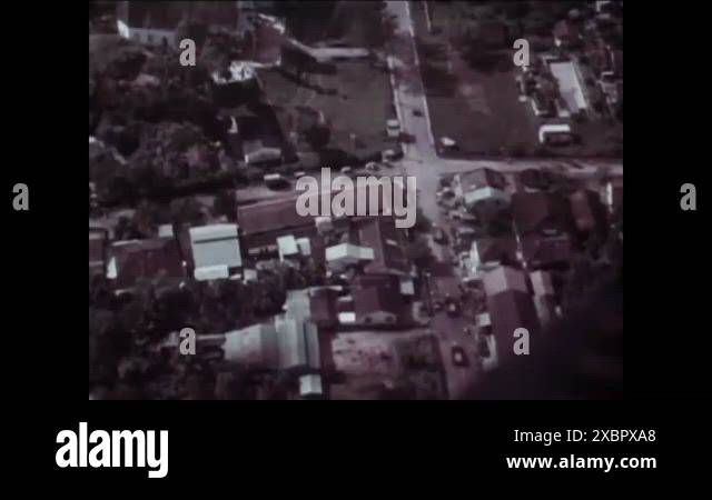 A US Military helicopter door gunner flies in a Huey during his first mission during the ...