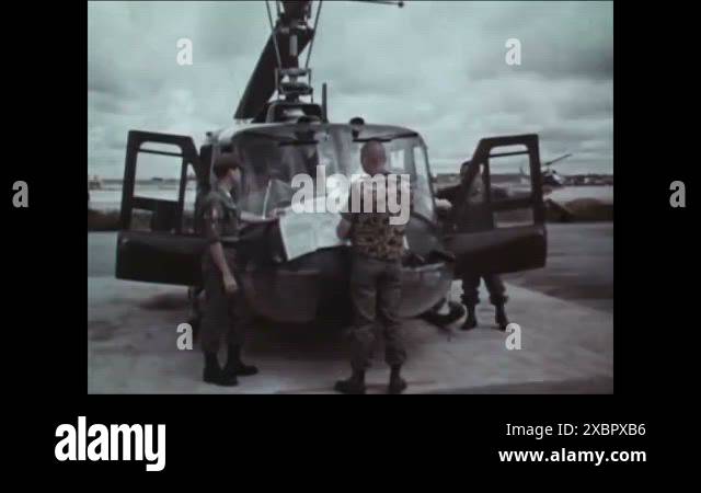 US Military Helicopter door gunners join the crew of a Huey combat ...