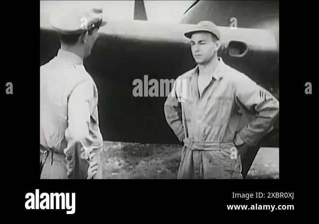 A captain and a flight crew chief talk; a lieutenant, the pilot, does ...