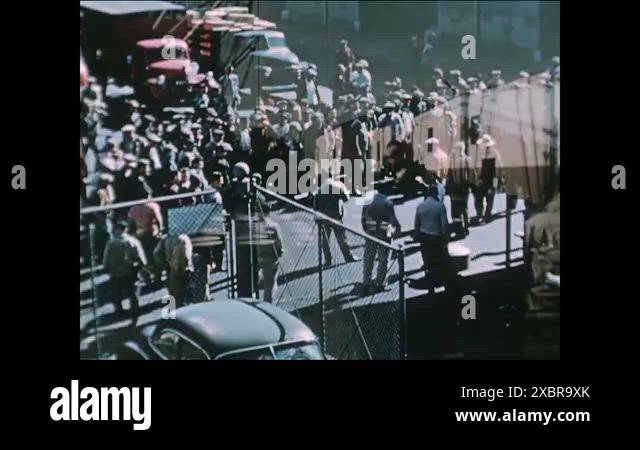 A forklift is driven and crates are lifted from the cargo hold of a ...