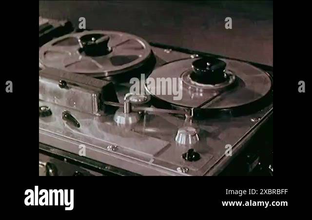 A woman plays a stereo LP album on a record player in the 1950s and we ...