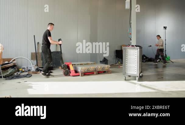 Technicians Working on Electric Car Battery Cell Module in Workshop ...