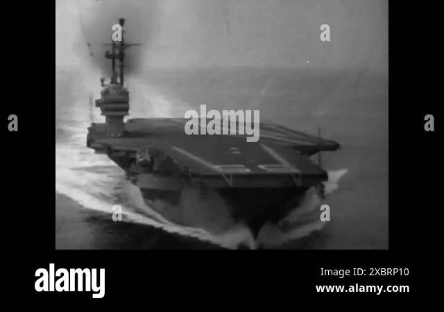 Men in the engine room of the USS Forrestal are shown as they send the ...