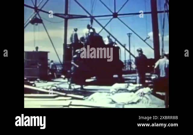 Members of the US Army remove a nuclear weapon from a truck bed during ...