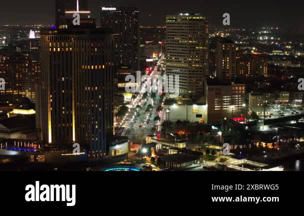 Vibrant night scene in downtown New Orleans with bustling Canal Street ...