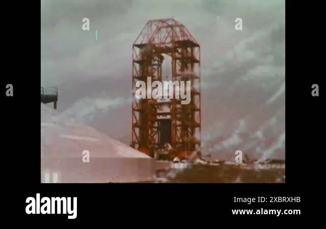 Flight controllers are shown in mission control and technicians prepare ...