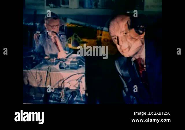 Early 1960s hands on shots of batteries and components being subjected ...