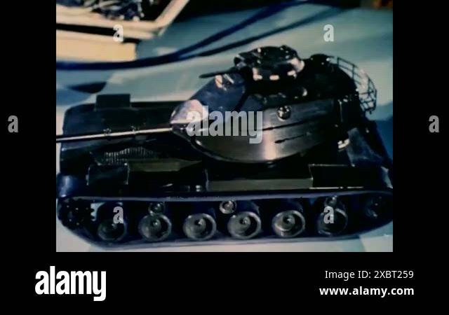 Early 1960s hands on shots of batteries and components being subjected ...