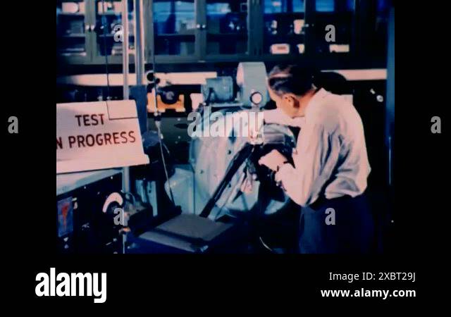 Early 1960s hands on shots of batteries and components being subjected ...