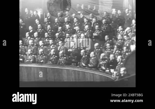 British Prime Minister Neville Chamberlain returns from Munich to tell ...
