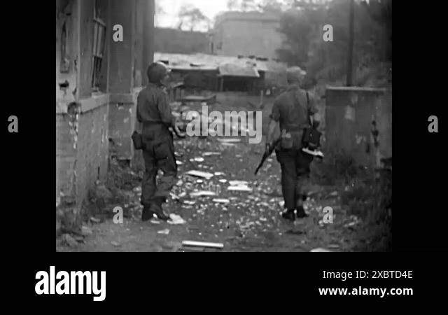 Soldiers in a village in the countryside and troops moving through a ...