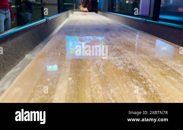 Closeup of Weights on Shuffleboard Table. Slow motion shuffle board ...