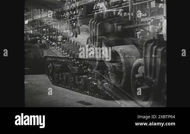 A rubber factory works to crank out tires during world war two Stock ...