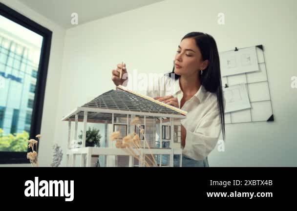 Professional young beautiful architect engineer using ruler and pencil ...