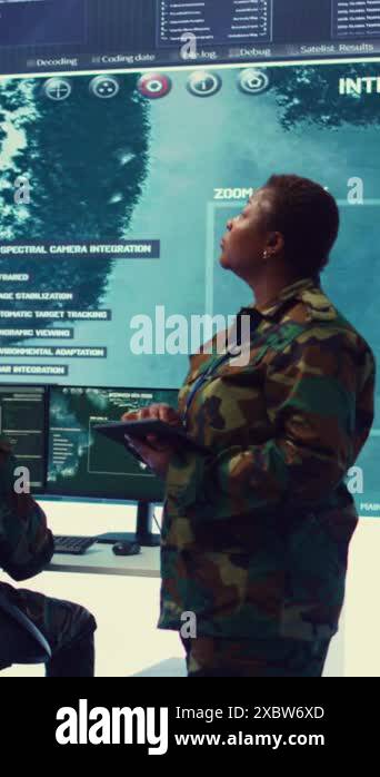 Vertical Video Woman high tech specialist studying satellite CCTV ...