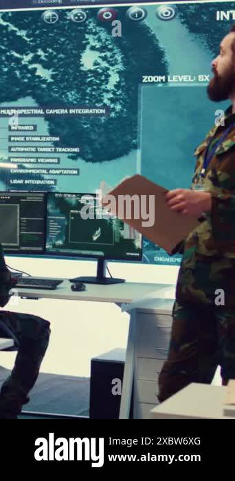 Vertical Video Army major reads operation details from a case file in a control center military ...