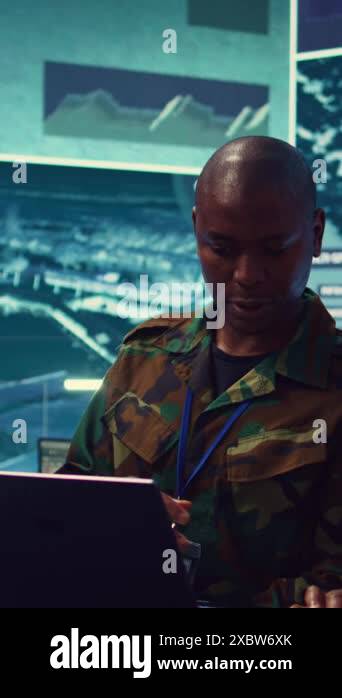 Vertical Video Special operations engineers examining surveillance ...