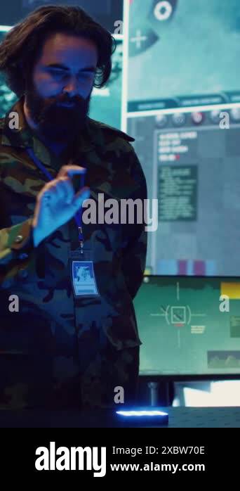 Vertical Video Infantry unit leader studies satellite imagery on a ...