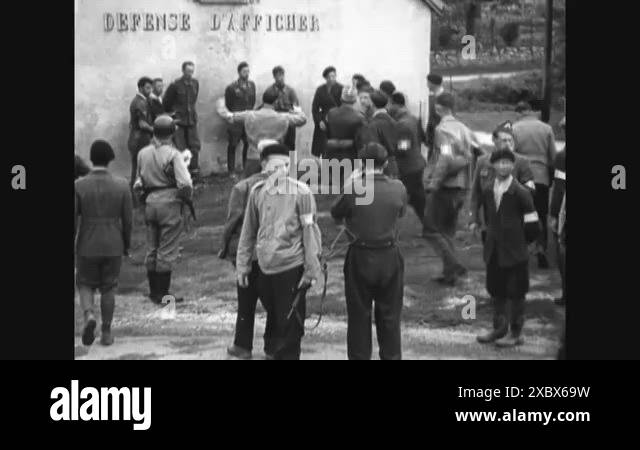 1944 - French civilians cheer as members of the FFI execute Nazi ...