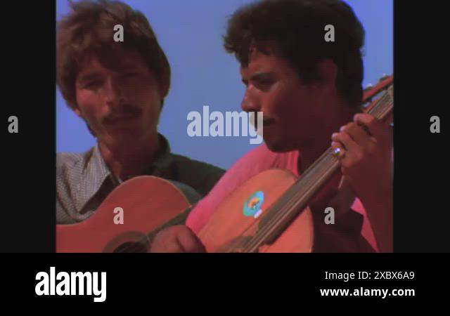 Musicians play on a beach and people drink in a bar in Havana, Cuba in ...