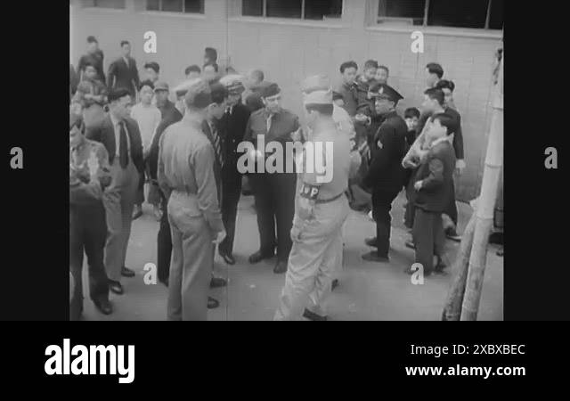 1946 - American CID officers are briefed on a dock in Shanghai Stock ...