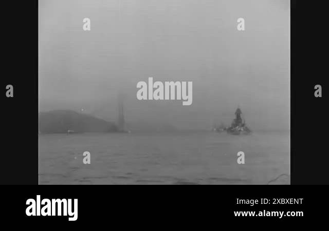 1930s - Panorama of US Navy ships sailing under the Golden Gate Bridge ...