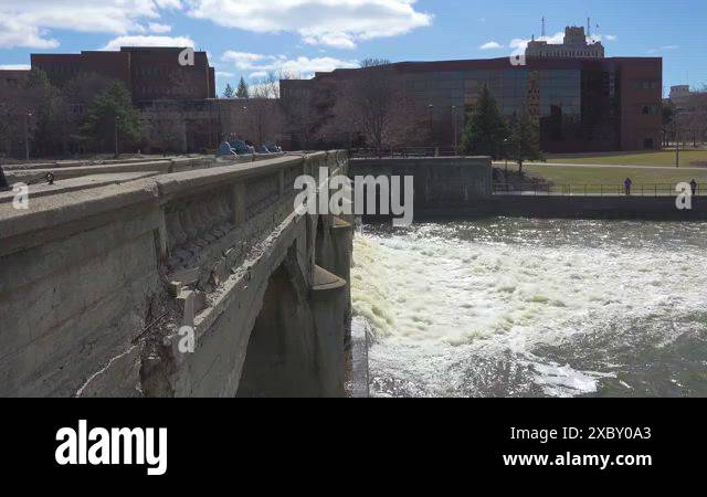 Polluted water flows from the Flint River through Flint, Michigan ...