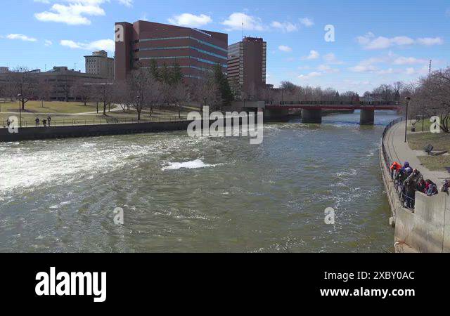 Polluted water flows from the Flint River through Flint, Michigan ...