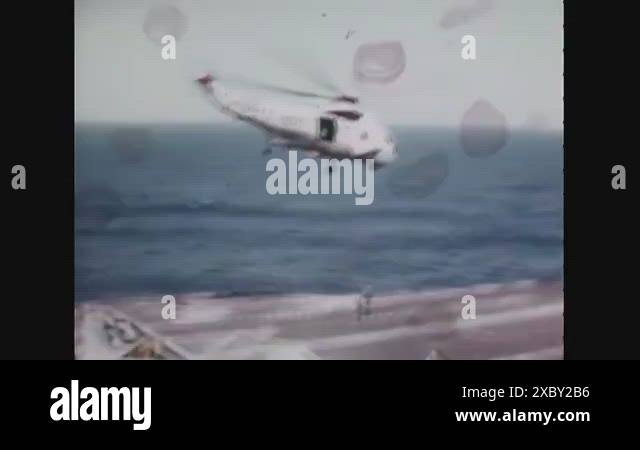 1970 - US Navy SH-3D and KA-3B helicopters hover over the USS Ranger ...