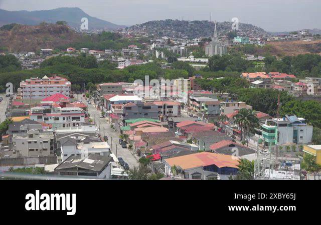 Establishing shot of the city of Guayaquil, Ecuador with Mormon church ...