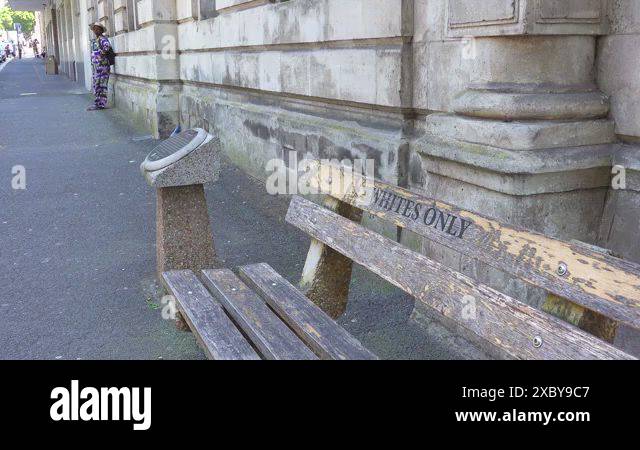 A bench sayings whites only along a street in Cape Town, South Africa ...