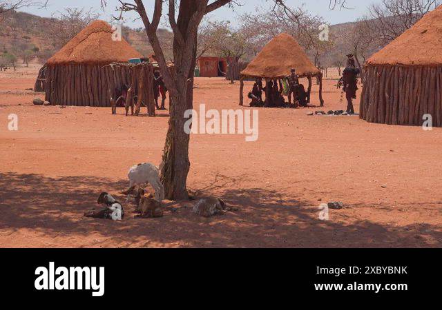 Small poor African Himba village on the Namibia Angola border with mud ...