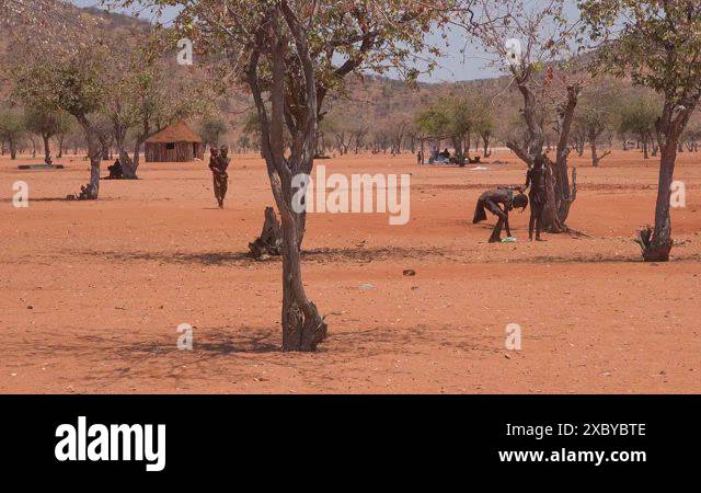 Small poor African Himba village on the Namibia Angola border with mud ...