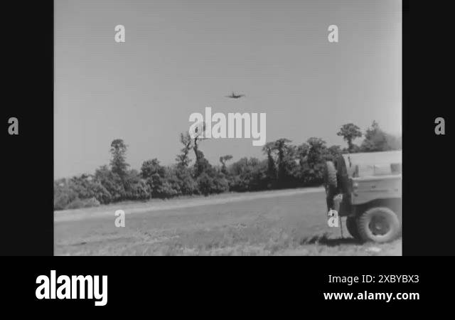 1944 - US Army Air Force mechanics service planes and reload machine ...