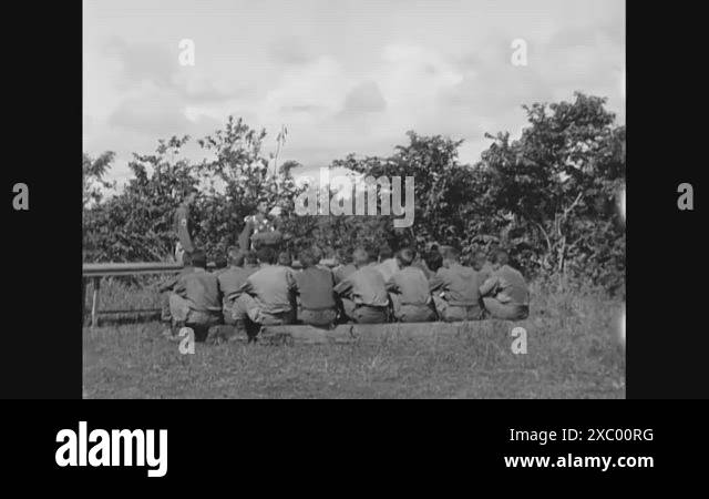 1945 - An instructor at a jump school in the Philippines shows US Army ...