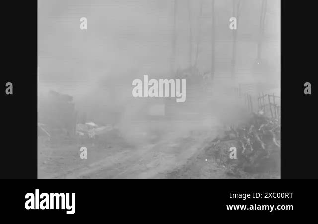 1945 - Men of the US Army's 7th Armored Division arrive at a burning ...
