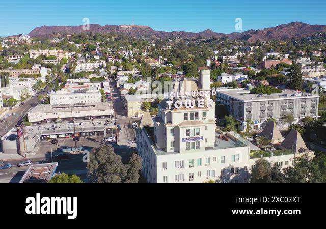 Aerial over the Hollywood Tower Hotel reveals the Griffith Park ...