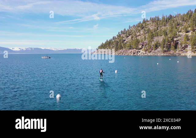 2020 - a man rides a hydrofoil hoverboard efoil electronic surfboard ...