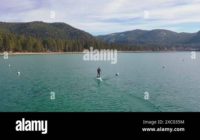 2020 - a man rides a hydrofoil hoverboard efoil electronic surfboard ...