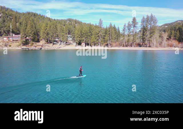 2020 - a man rides a hydrofoil hoverboard efoil electronic surfboard ...