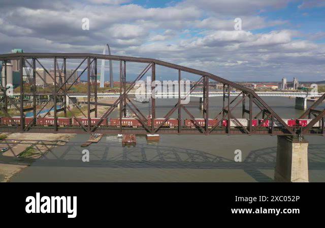 Aerial of a freight train crossing the Mississippi River with the St ...