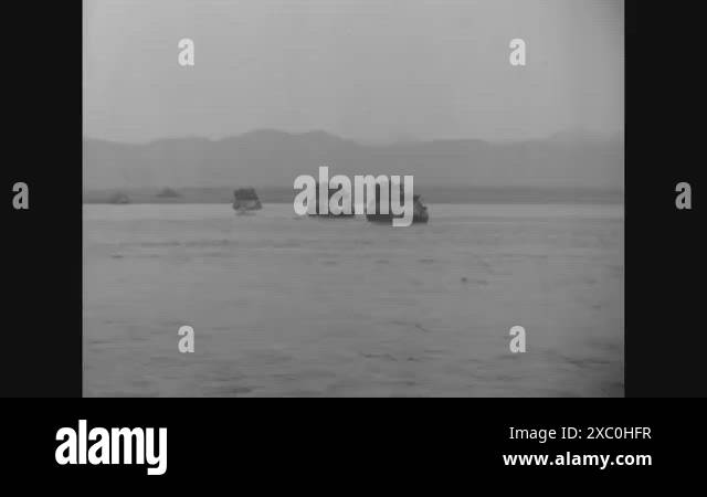 1951 - ROK and American soldiers ford a river in Chuncheon, Korea, atop ...