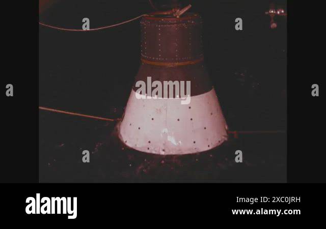 1962 - Alan Shepard climbs out of an egress capsule in a testing water ...