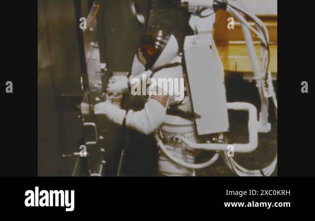 1967 - Astronauts test the Litton hard suit in fine motor and walking ...