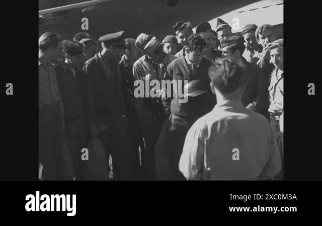 1944 - Repatriated USAF airmen freed in Operation Reunion share Nazi helmets and hats they ...