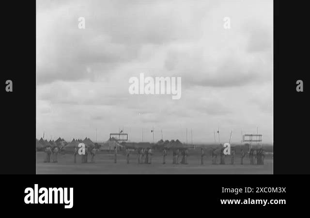 1945 - Men of the 201st Mexican Air Squadron salute as the bugle is ...