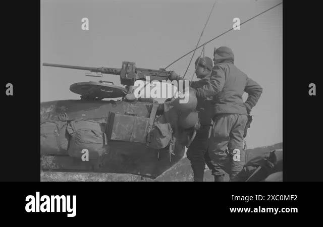 1951 - American soldiers fire a 50 caliber machine gun from the turret ...