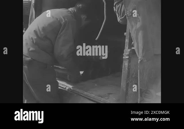 1951 - American soldiers load mortar shells and barracks bags into ...