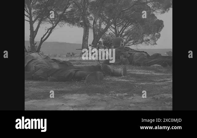 1944 - Men of the 45th Division rush the woods in La Muy and others sit ...